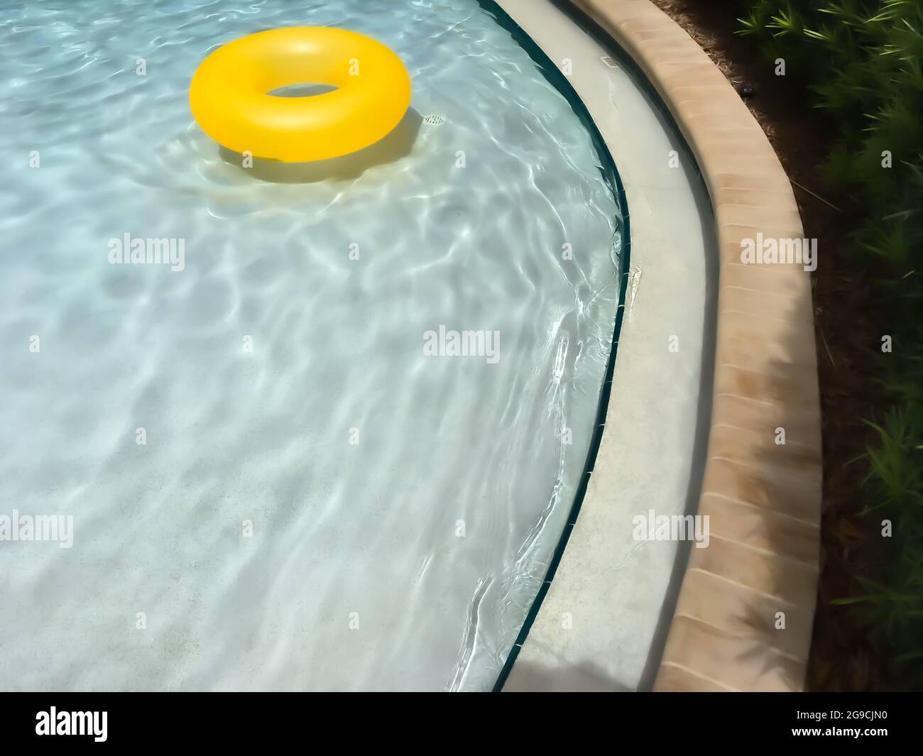 Swimming pool Florida resort, with yellow tire shape float Stock Photo ...