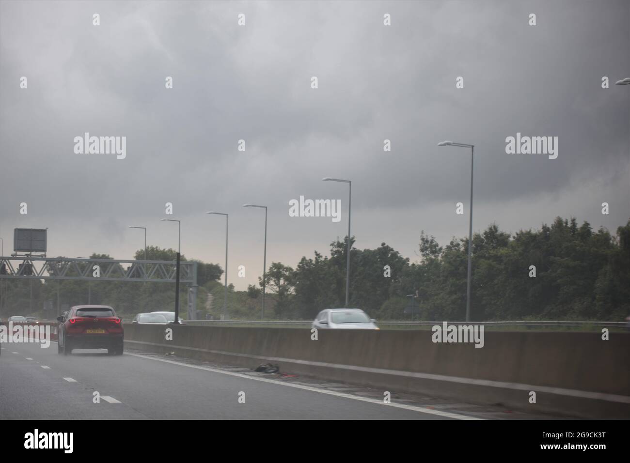 Road traffic driving in heavy rain Stock Photo - Alamy