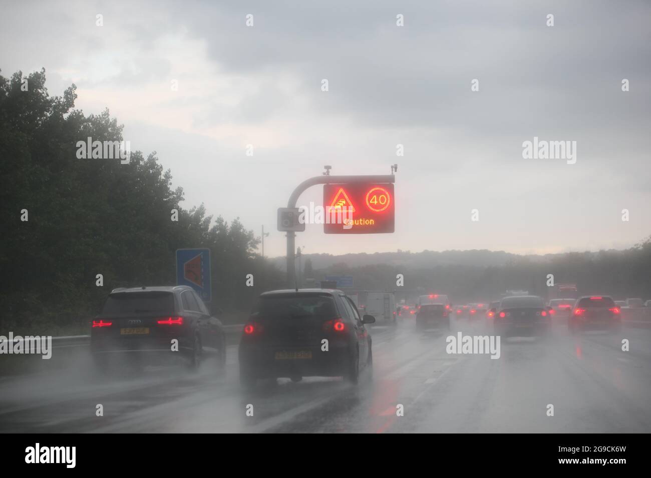 Cars driving in wet weather cautioned to slow down with speed ...