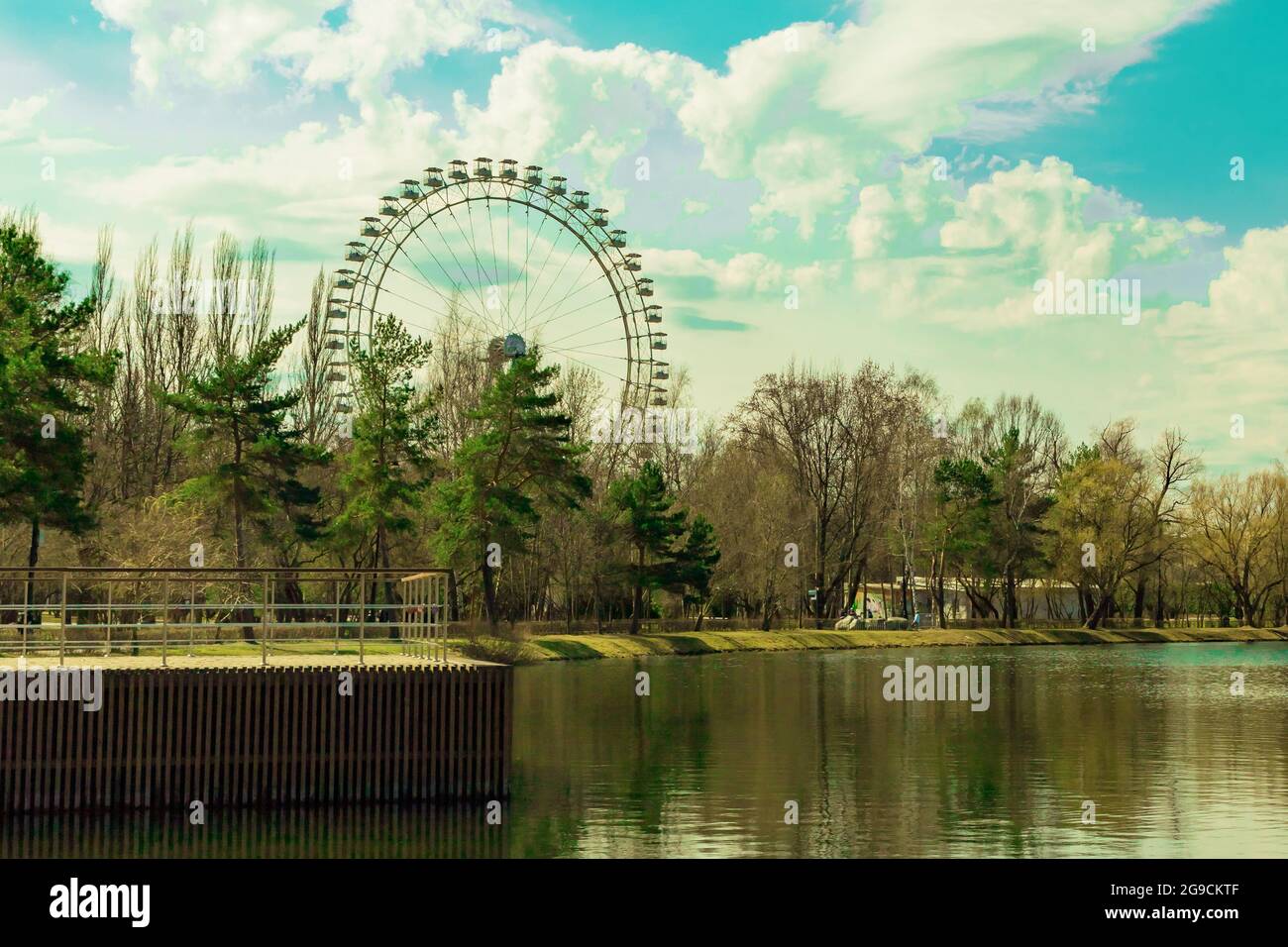 Moscow, Russia April 18 2021: Izmailovsky park pond view on big ferris ...