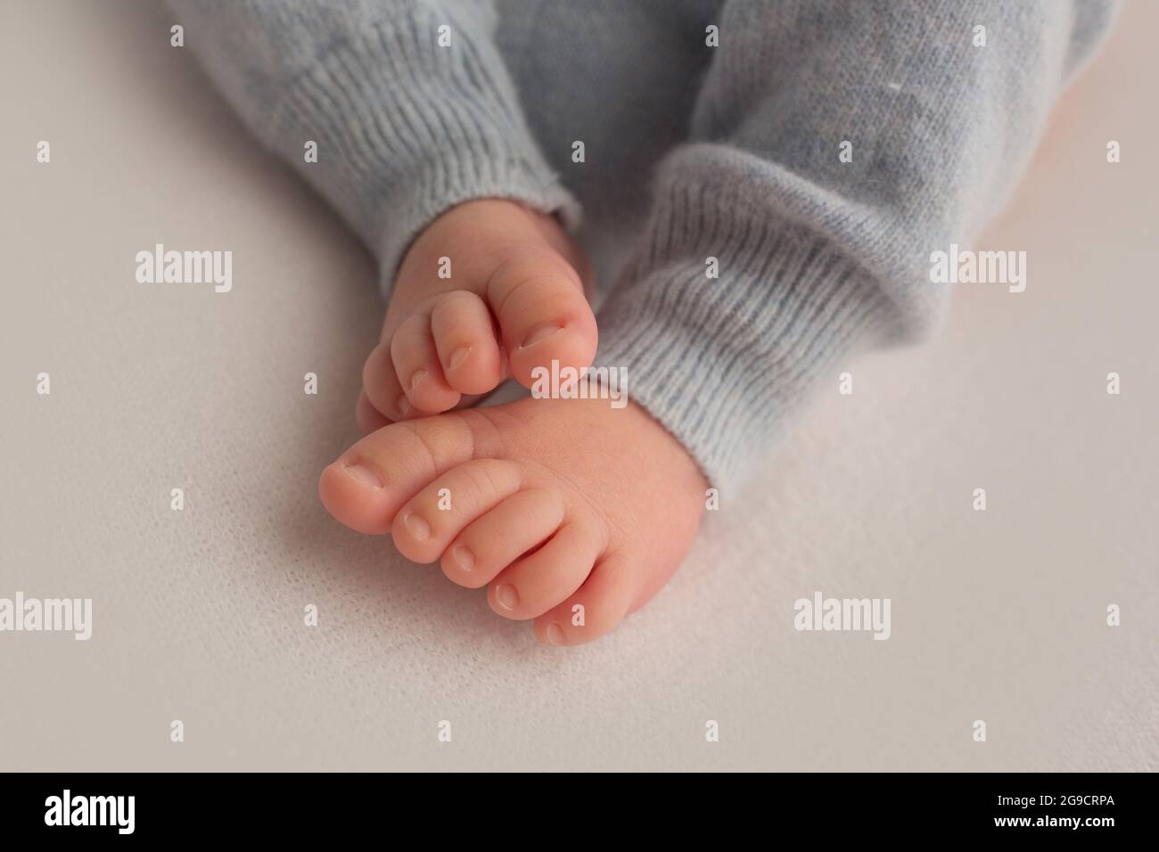 Newborn baby feet closeup. Pregnancy, motherhood, preparation and ...