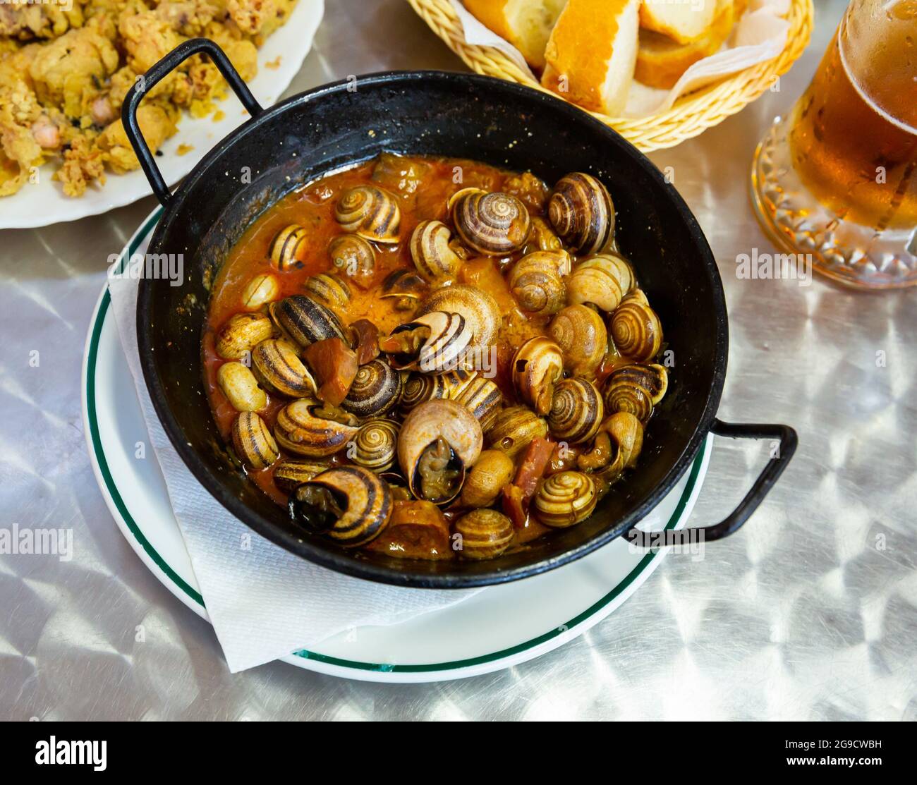 Tapas food snails restaurant hi-res stock photography and images - Alamy