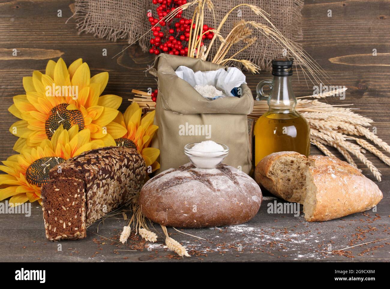 Different types of rye bread on wooden table on wooden background Stock ...