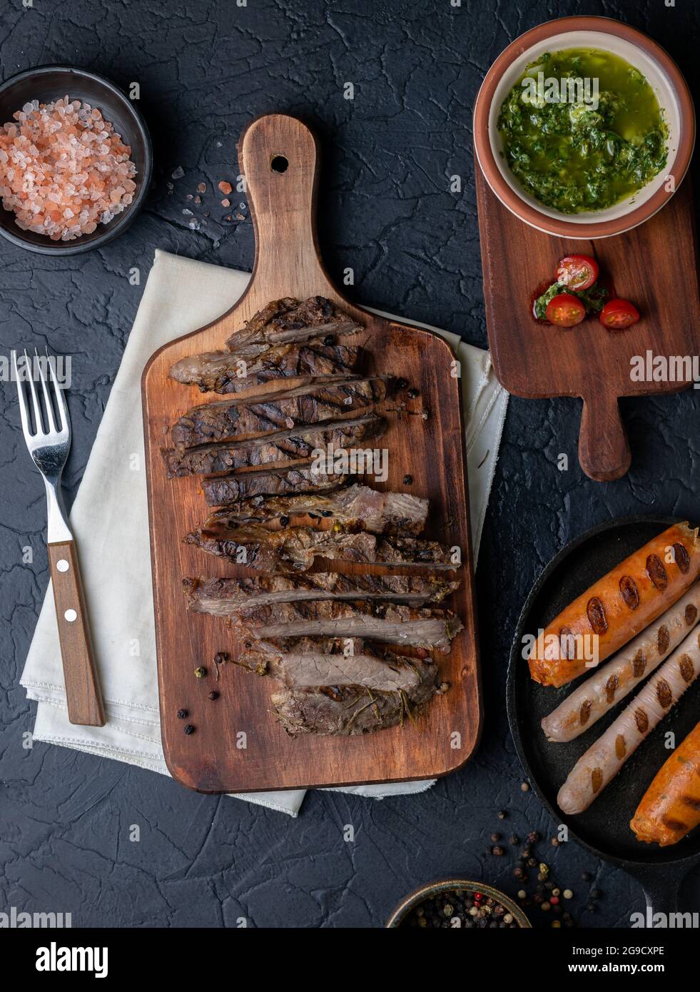 A vertical top view of a delicious steak cut into thin strips on a ...