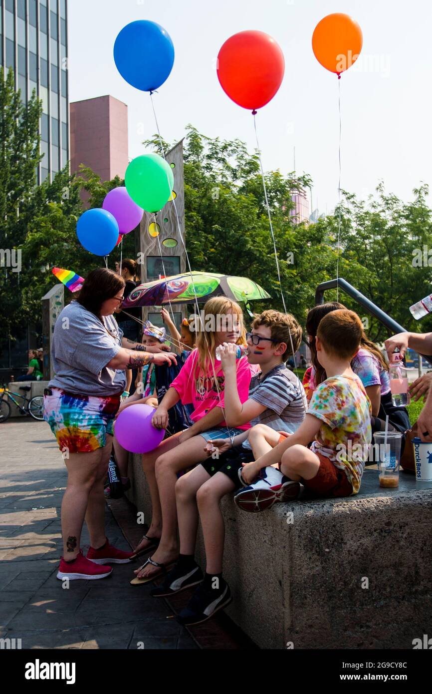 Kids with balloons, during the pride parade through the heart of the ...