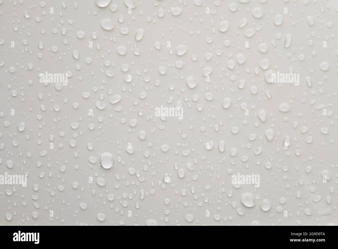 Water droplets on shiny white metallic surface Stock Photo - Alamy