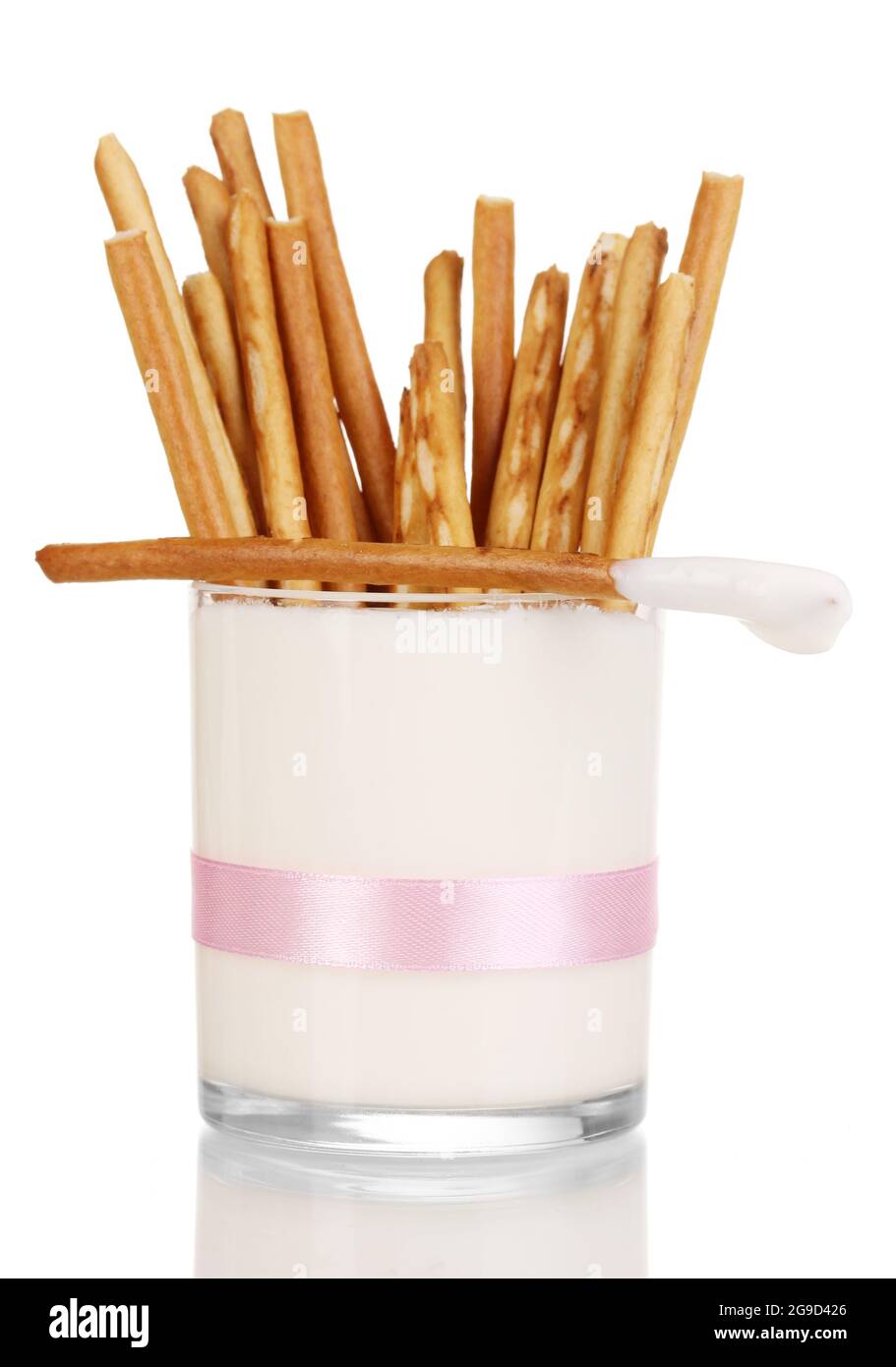Tasty crispy sticks in glass with sour cream isolated on white Stock ...