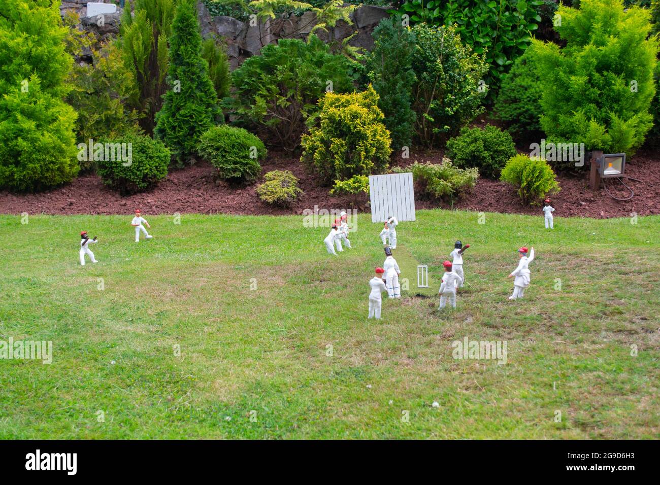 Closeup photo of tiny model people playing cricket Stock Photo - Alamy