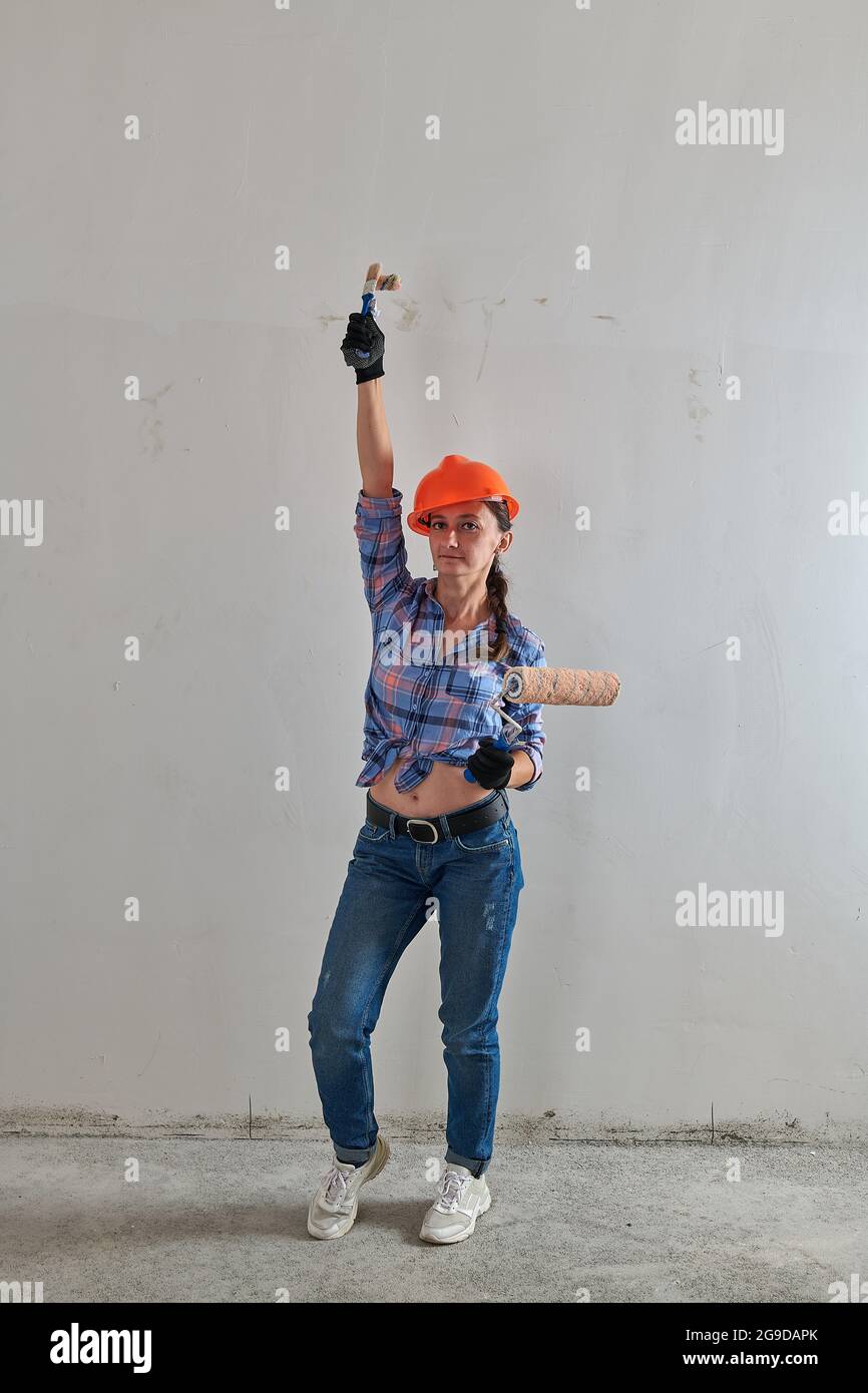 cool worker with a set of tools and a roller Stock Photo - Alamy
