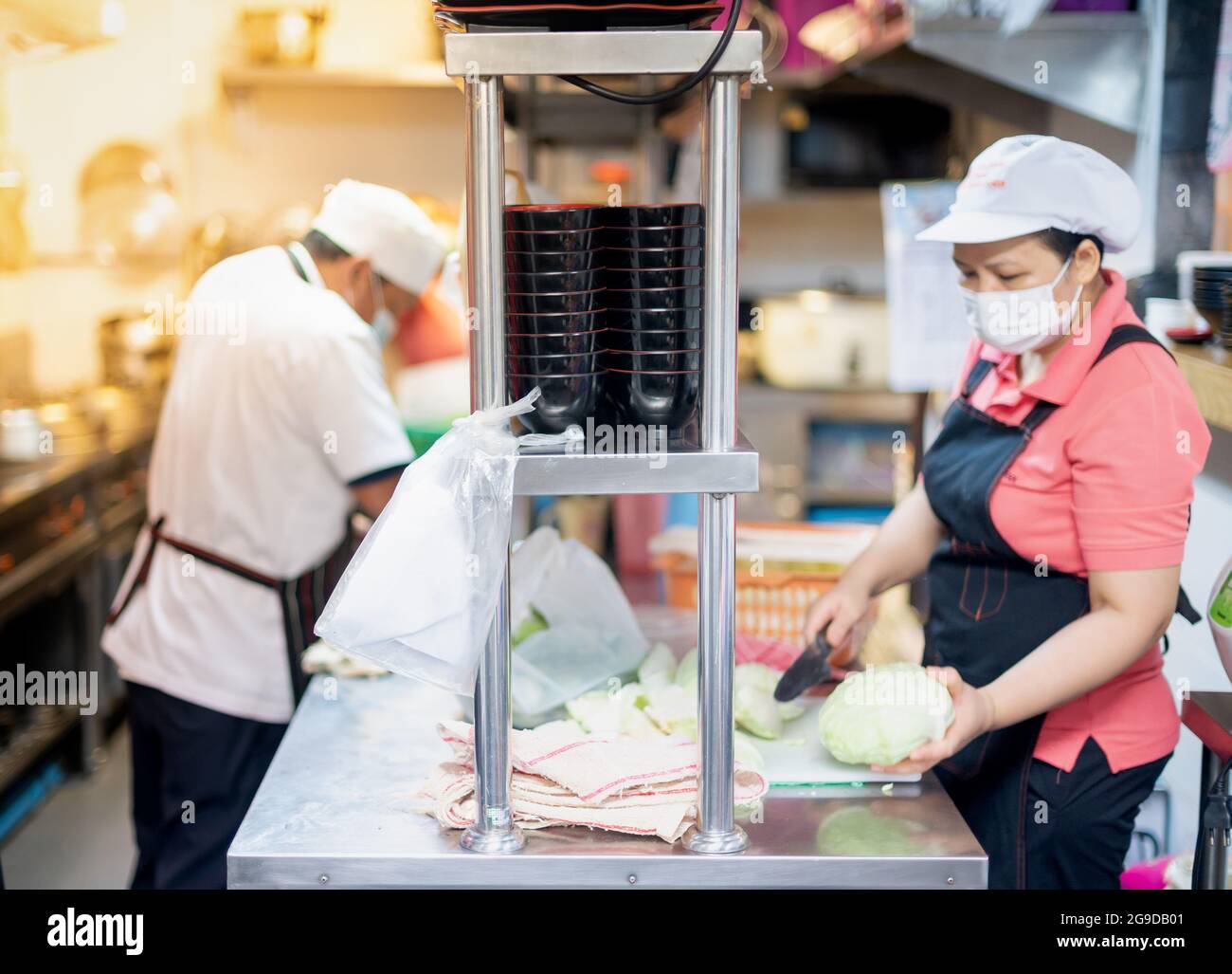 In his kitchen with his assistant chefs hi-res stock photography and ...