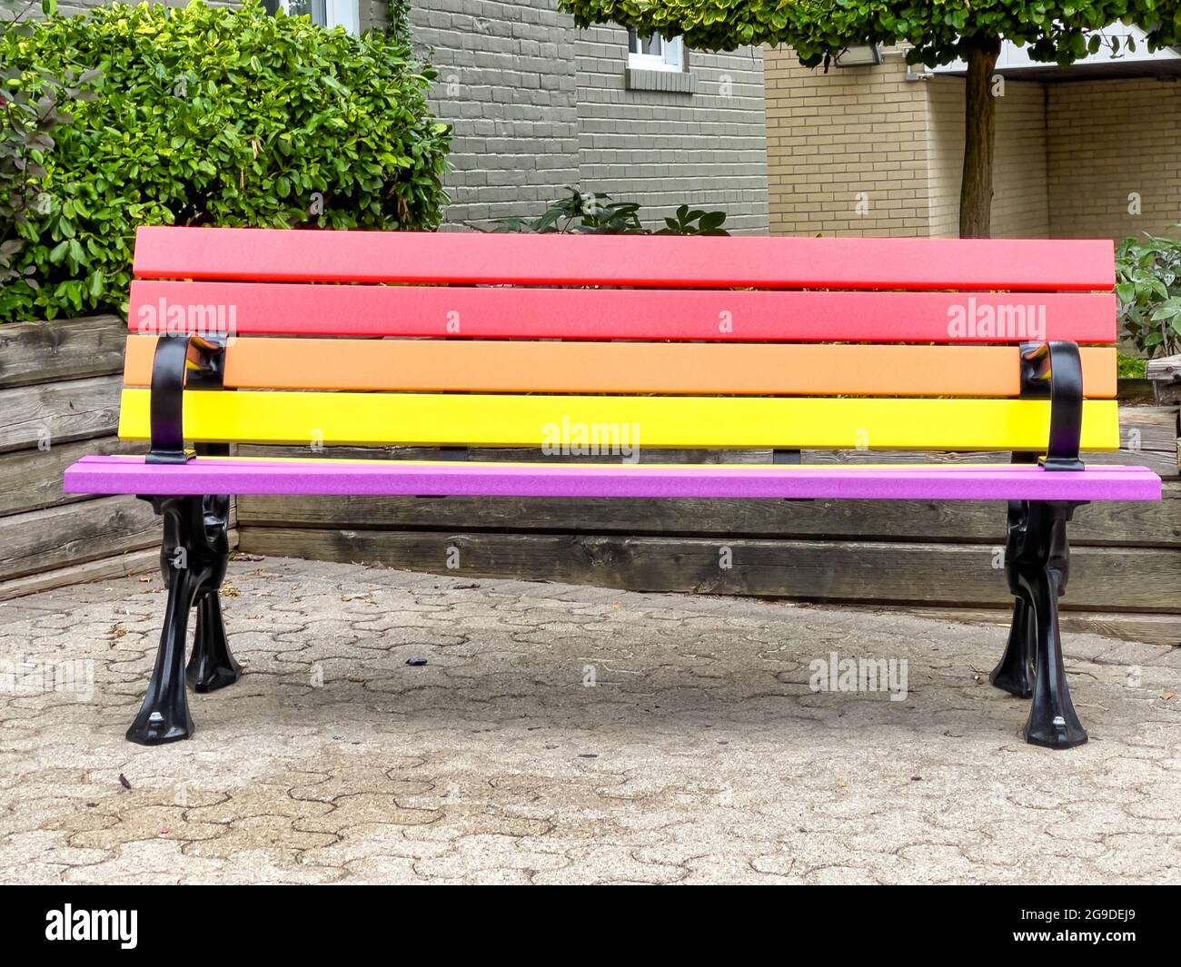 Bench with the pride rainbow colors in the historic district of ...