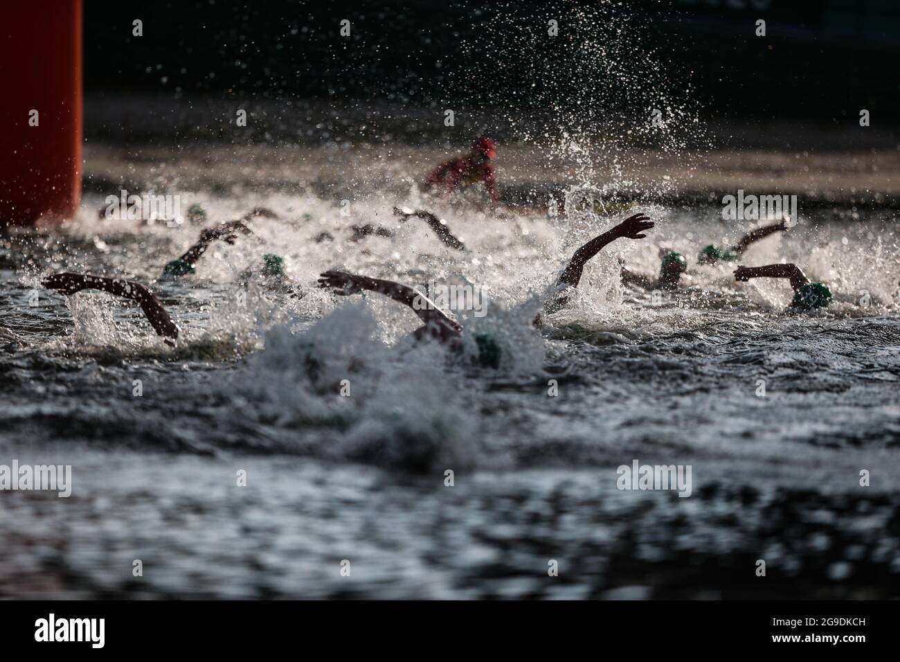 Tokyo, Japan. 26th July, 2021. Atheletes swim during the triathlon men ...