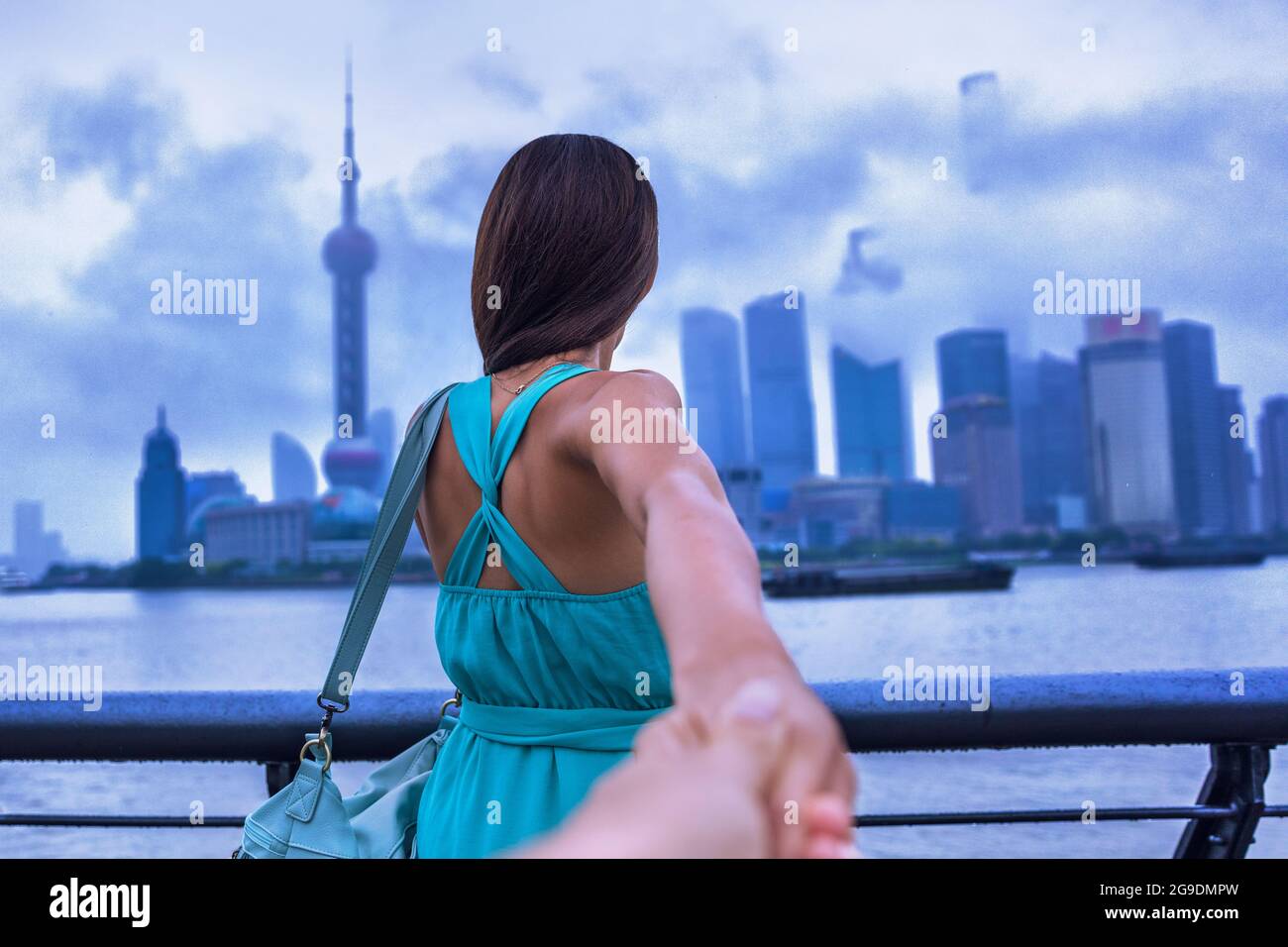 Follow me couple girlfriend travelling in Shanghai Stock Photo - Alamy