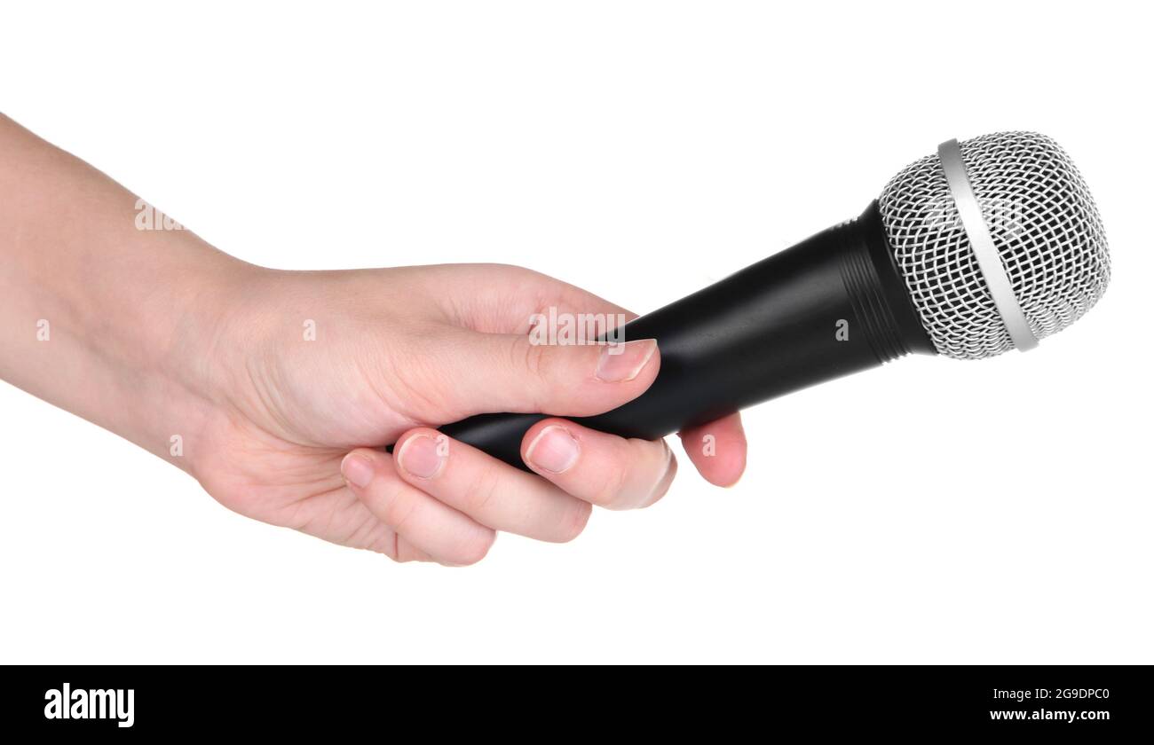 Black microphone in hand isolated on white Stock Photo - Alamy