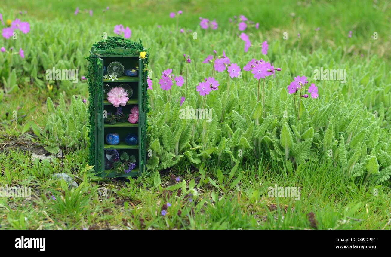 Tiny beautiful wardrobe or closet from dollhouse with magic ogjects of ...