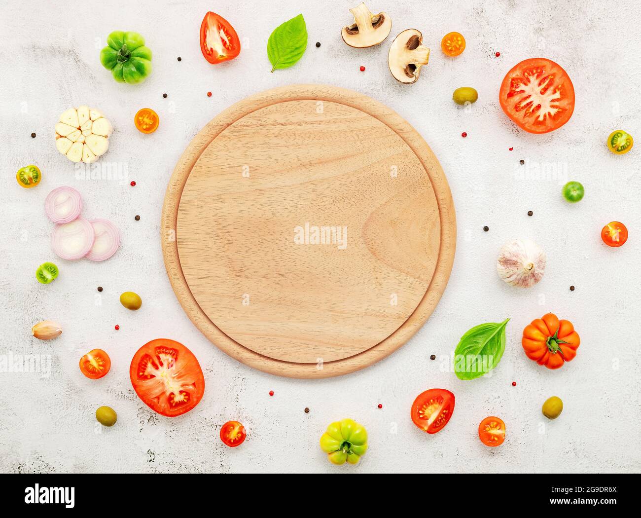 The ingredients for homemade pizza set up on white concrete background ...