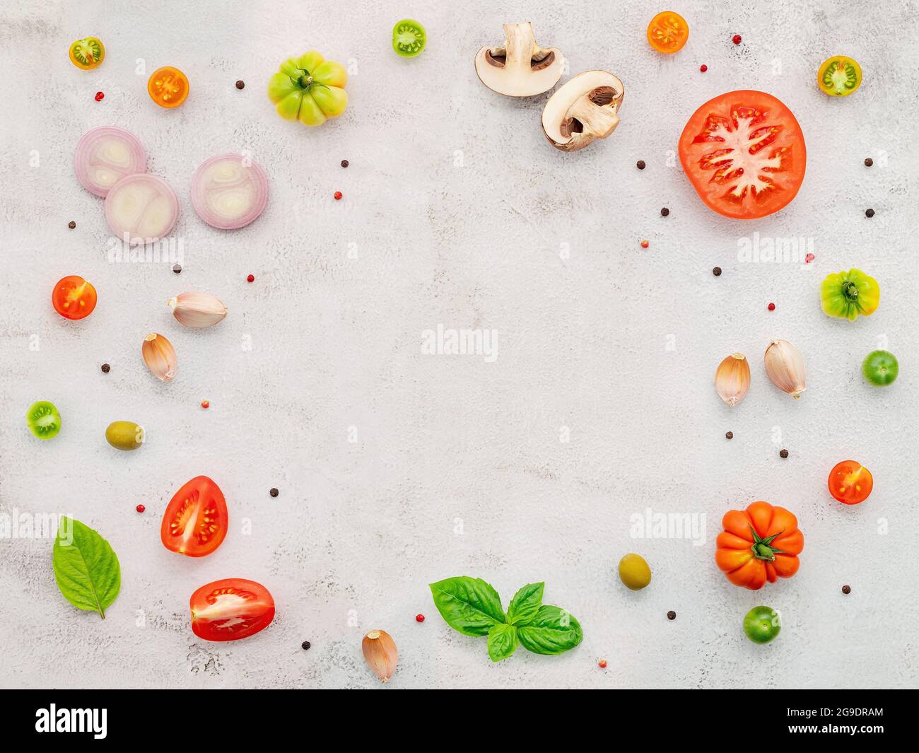 The ingredients for homemade pizza set up on white concrete background ...
