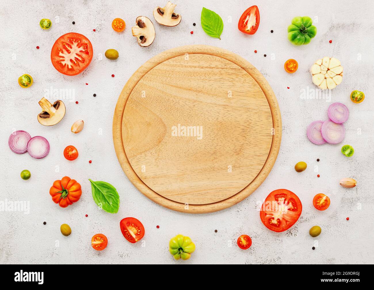 The ingredients for homemade pizza set up on white concrete background ...