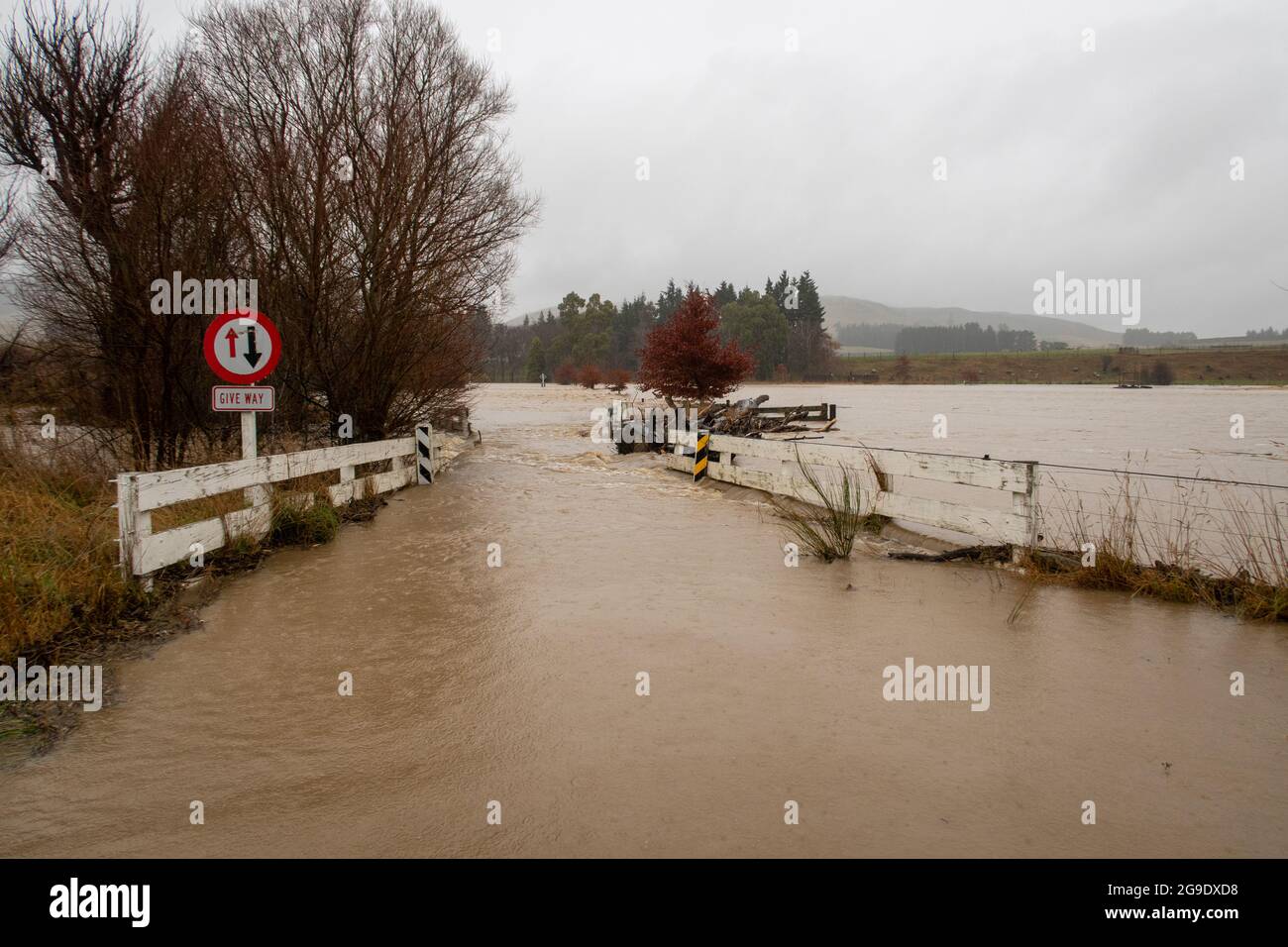 Heavy and continual rain causes the Hawkins River to flood and flow ...