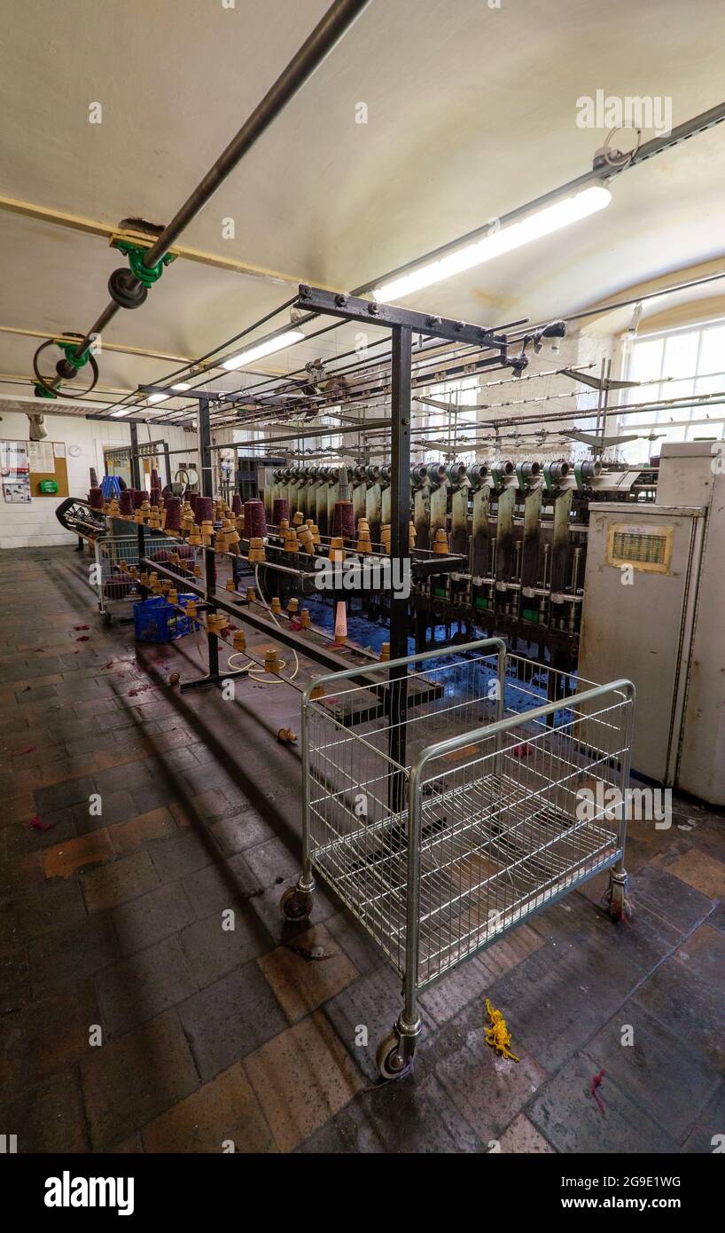 Stacks of wool on metal stands which is part of the woollen mill at New ...