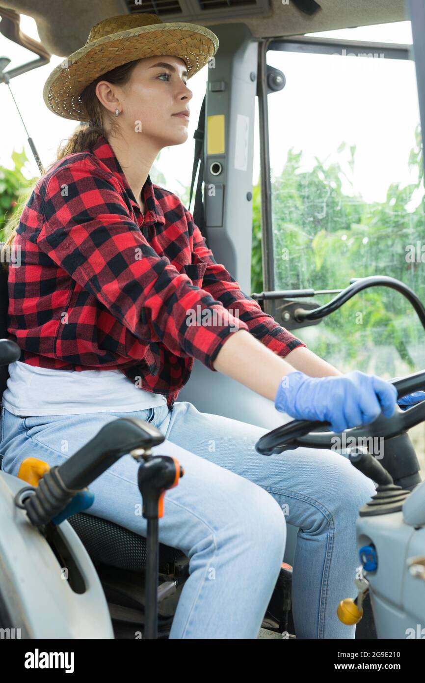 Female farmer driving tractor hi-res stock photography and images - Alamy