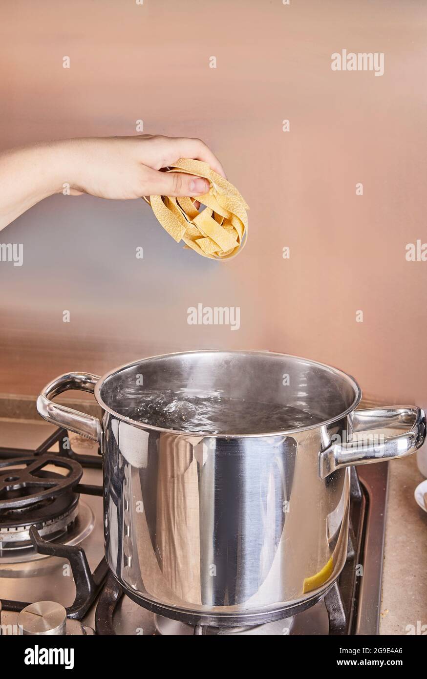 Teenager tossed pasta into boiling water for spaghetti bolognese using ...