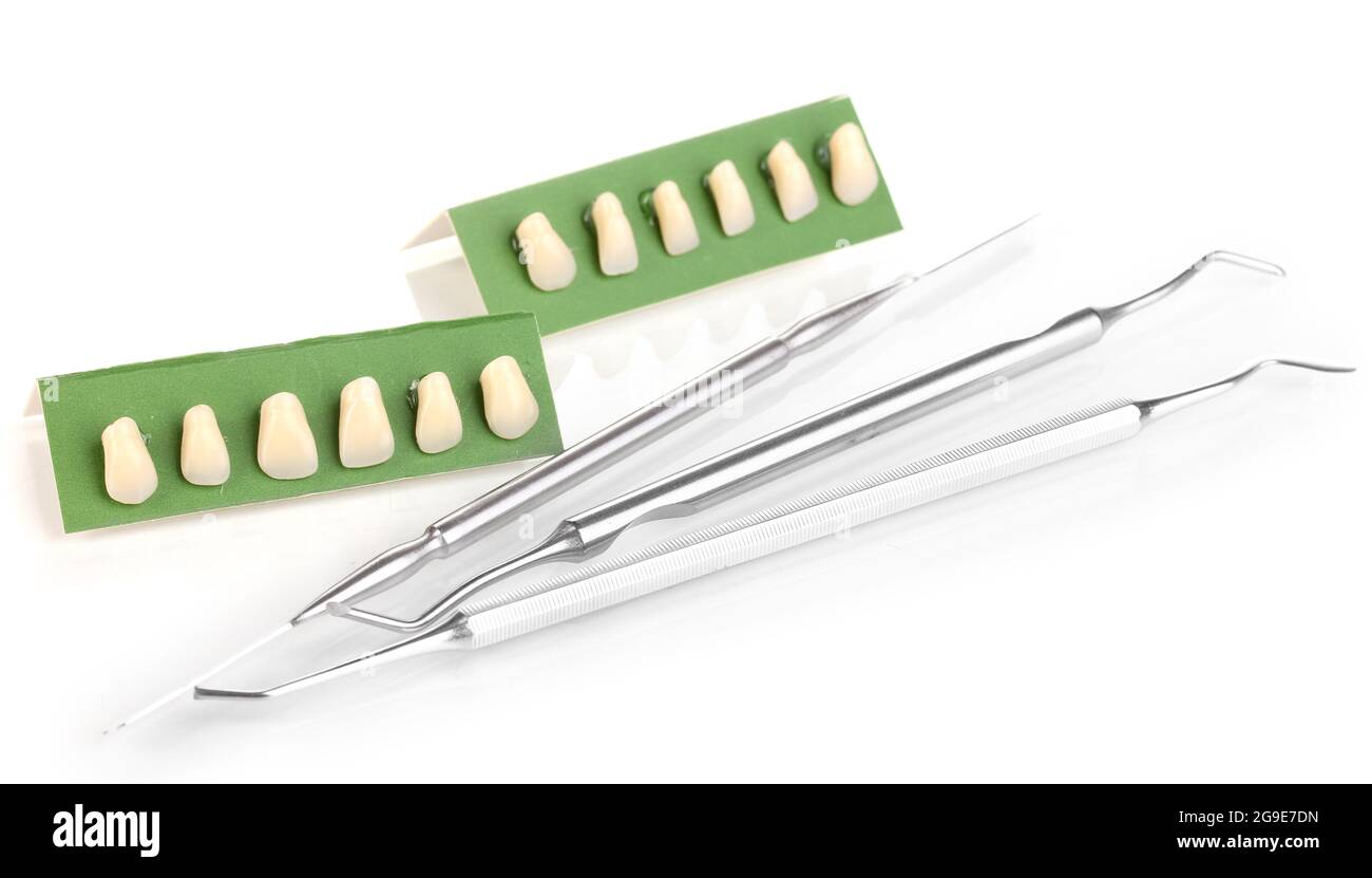 denture with dental tools isolated on white Stock Photo - Alamy