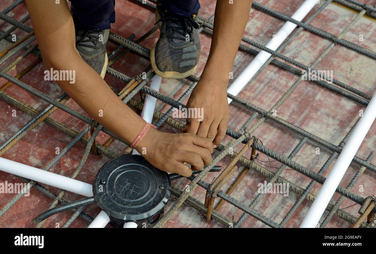 Electric fixture installation during flat construction Stock Photo - Alamy