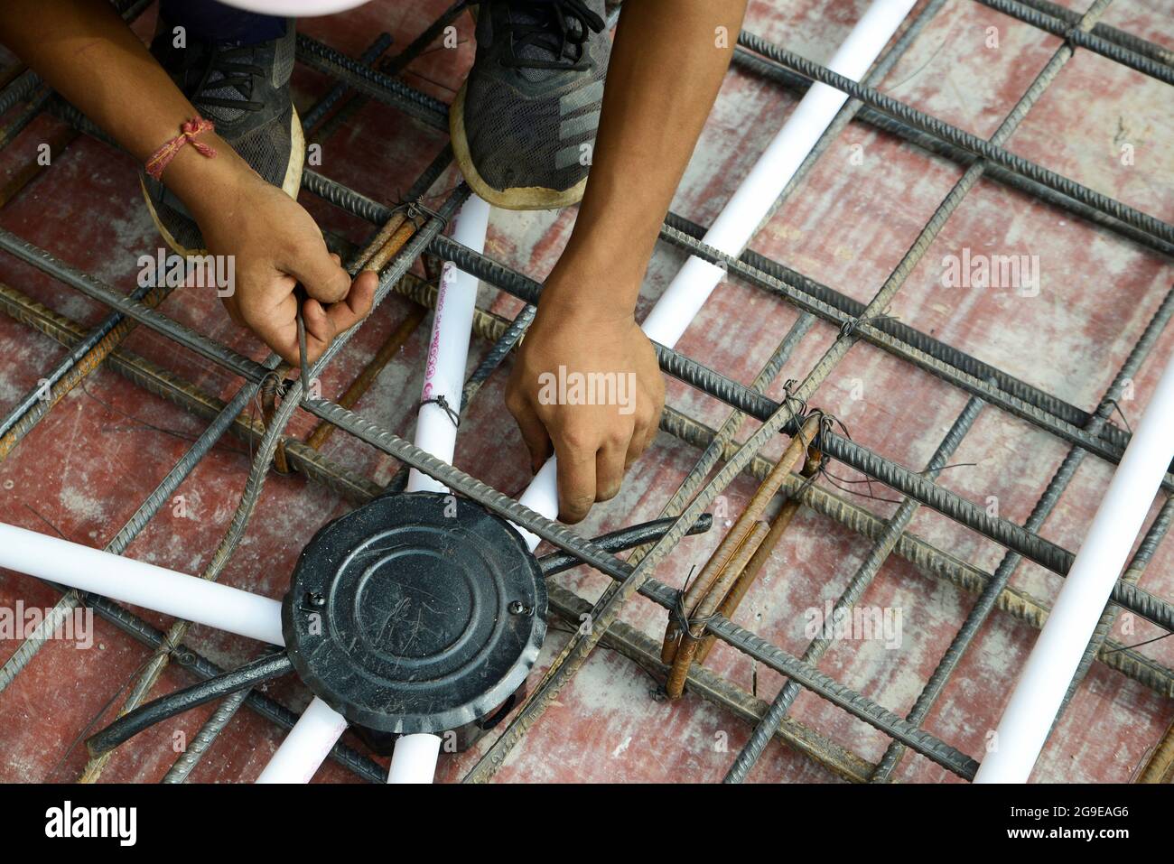 Electric fixture installation during flat construction Stock Photo - Alamy