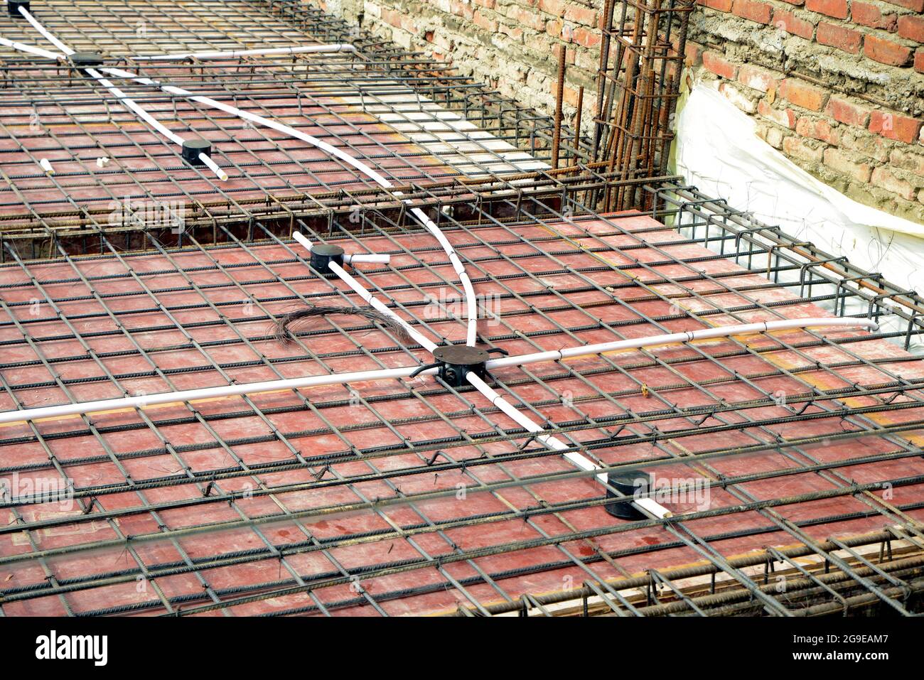 Electric fixture installation during flat construction Stock Photo - Alamy