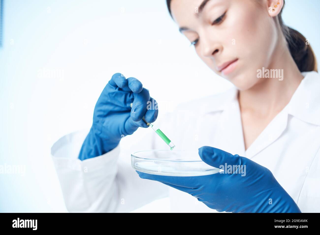 female laboratory assistant chemical solution research biotechnology ...