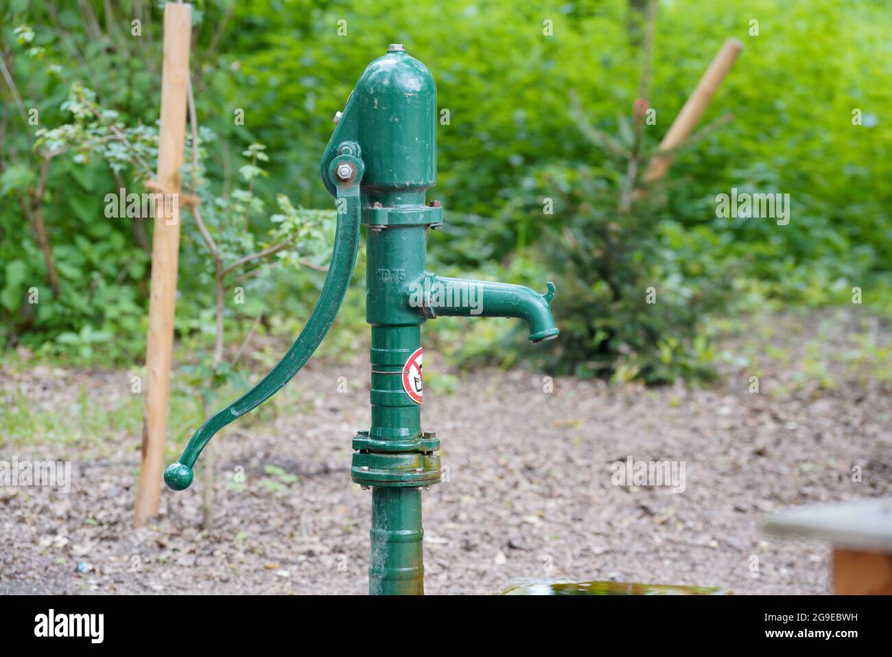 Selective focus a tall well pitcher hand water pump in a rural area ...