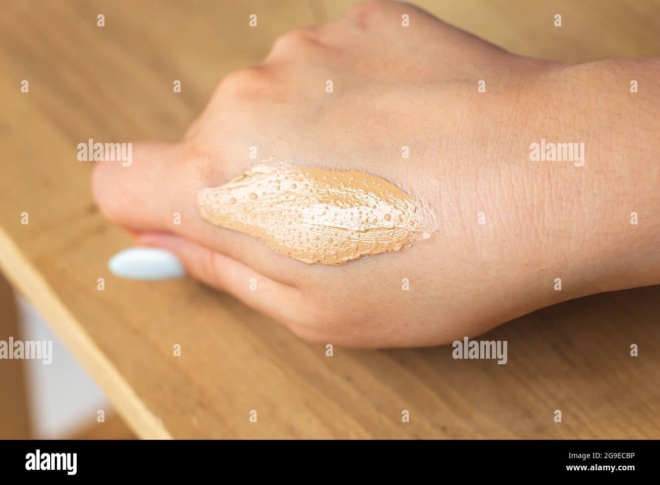 Moisturizing cream texture on women's hand Stock Photo - Alamy