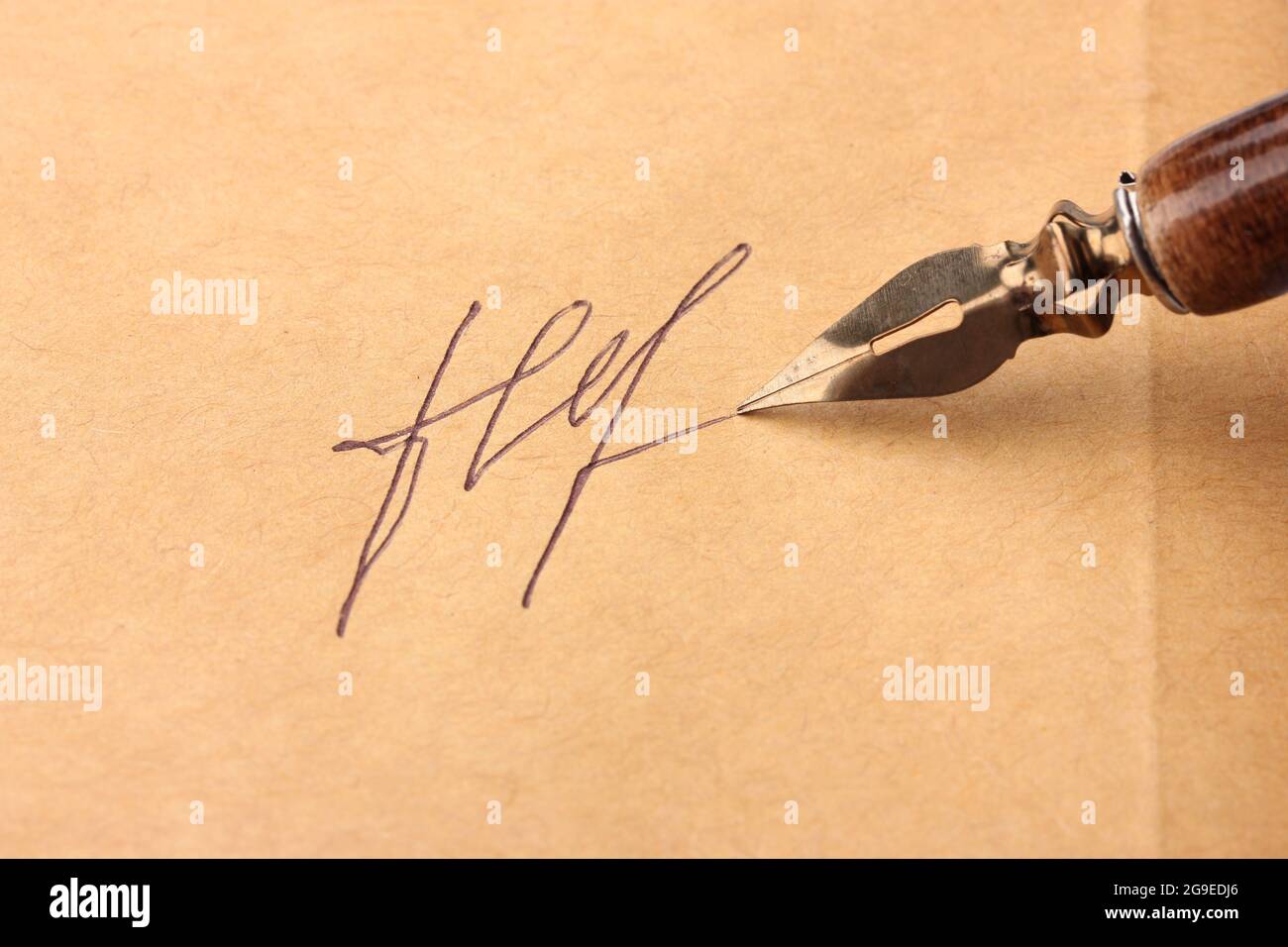 Closeup of signature (fake, not real) and ink pen, on old paper Stock ...