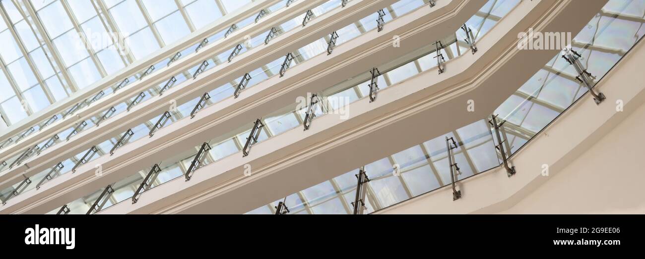 Modern spacious building with glass roof from inside Stock Photo - Alamy