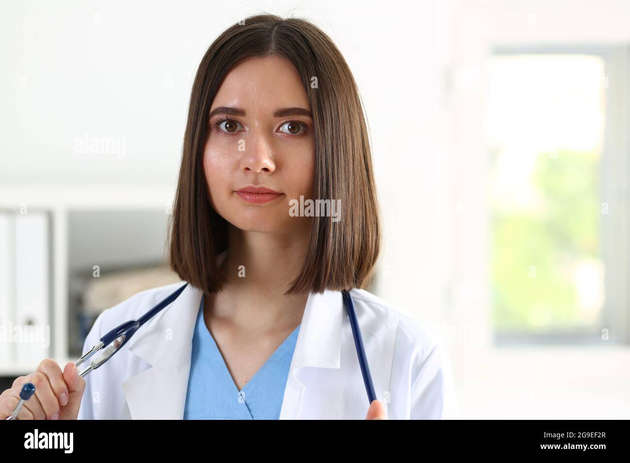 Beautiful smiling female doctor stand in office portrait Stock Photo ...