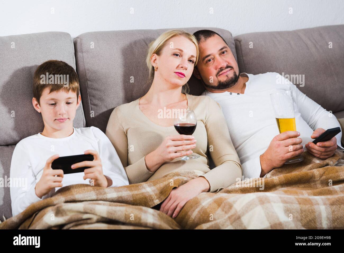 Family relaxing together Stock Photo - Alamy