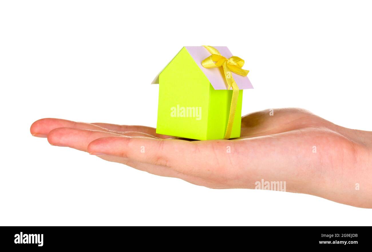 Small house in hand isolated on white Stock Photo - Alamy
