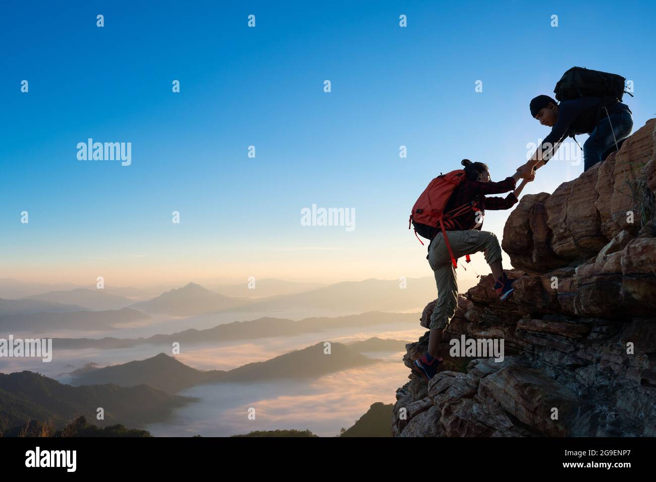 Teamwork couple hiking help other hi-res stock photography and images ...