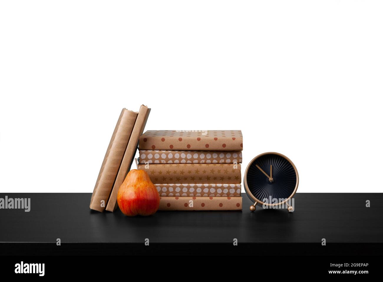 Stack of books and alarm clock, time to read concept Stock Photo - Alamy