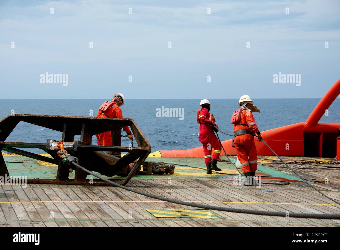 marine crew working on deck during cargo handling operation for jack up ...
