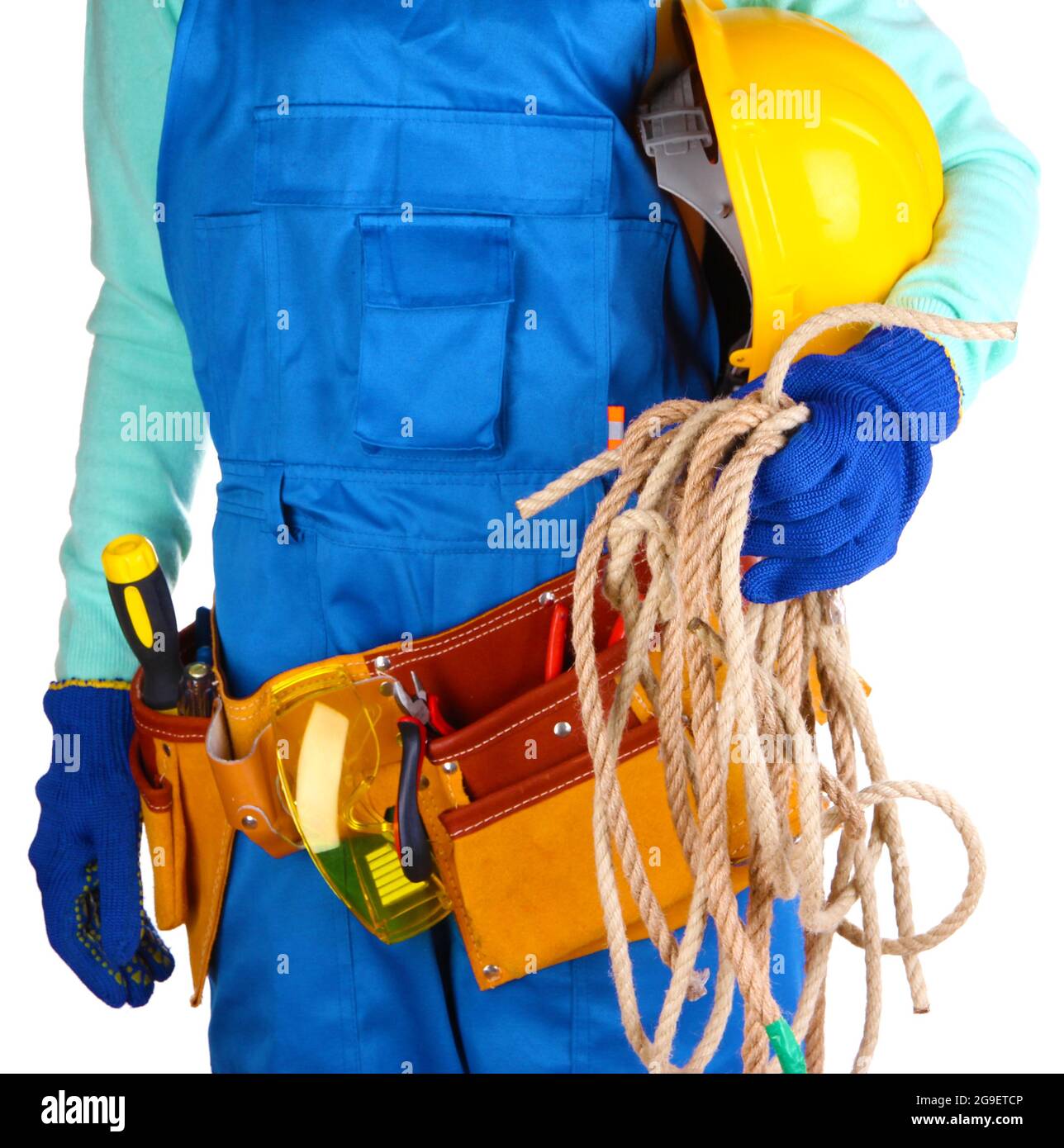 Male builder in blue overalls with rope and helmet isolated on white ...