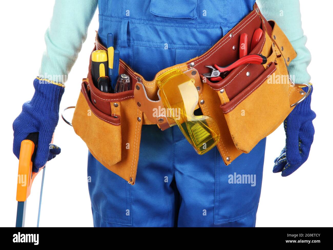 Male builder in blue overalls with saw isolated on white Stock Photo ...