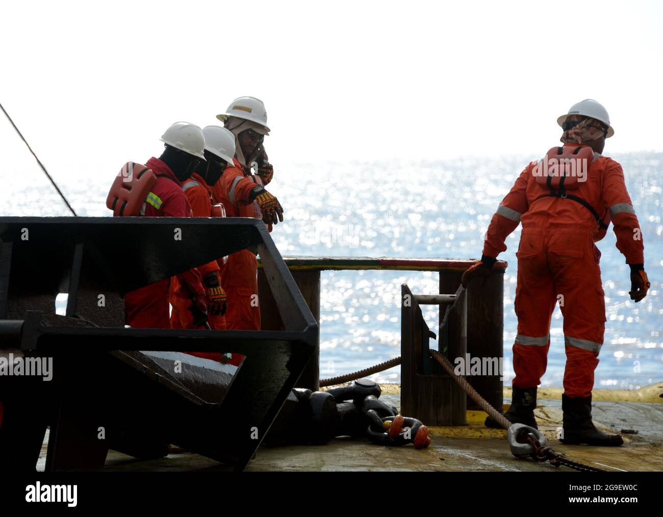 marine crew working on deck during cargo handling operation for jack up ...
