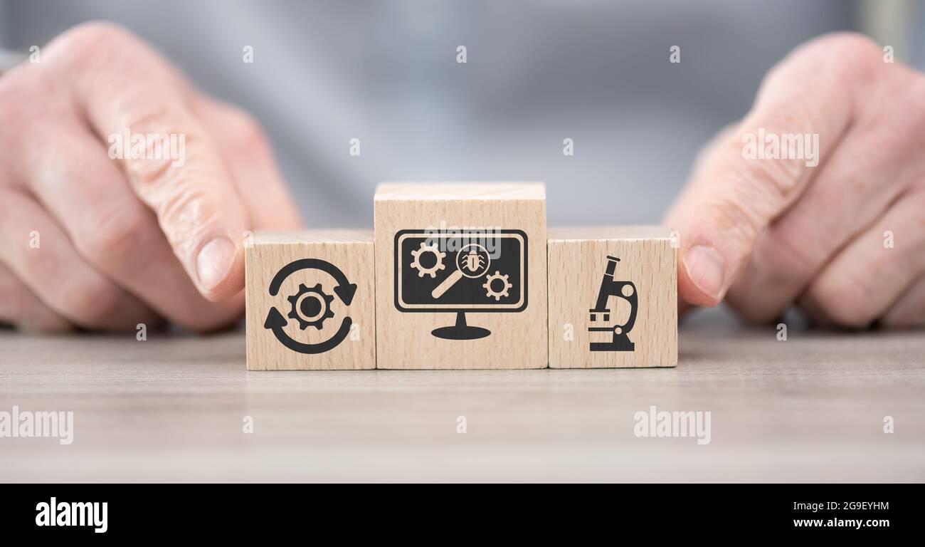 Wooden blocks with symbol of software testing concept Stock Photo - Alamy