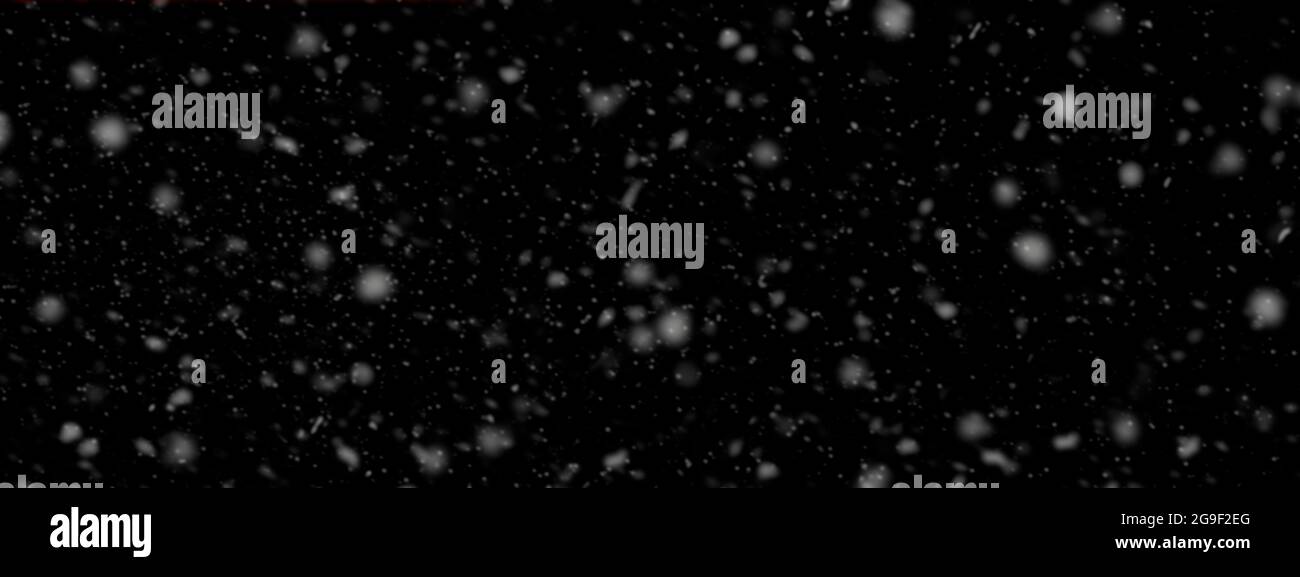 Falling snow on black background stock photo Stock Photo - Alamy