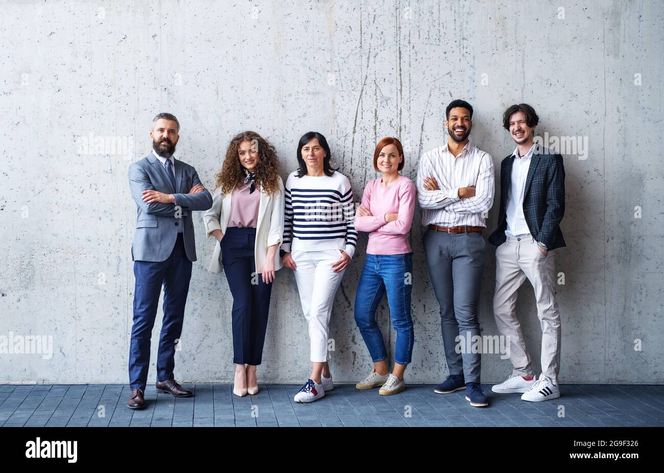 Group businesspeople standing together against hi-res stock photography ...