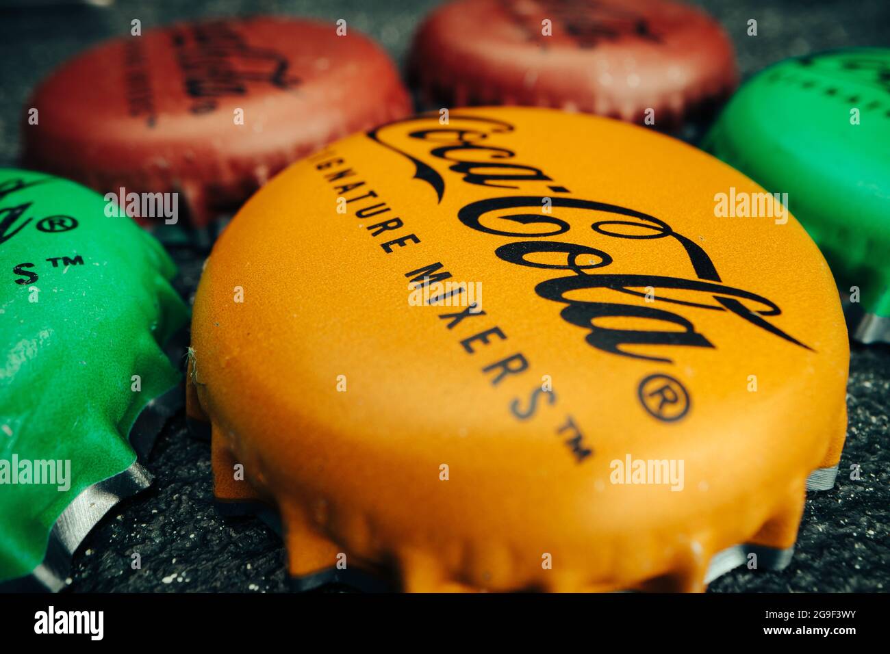 KRASNODAR, RUSSIA - NOVEMBER 9, 2020: Macro photo of Coca Cola lids on ...