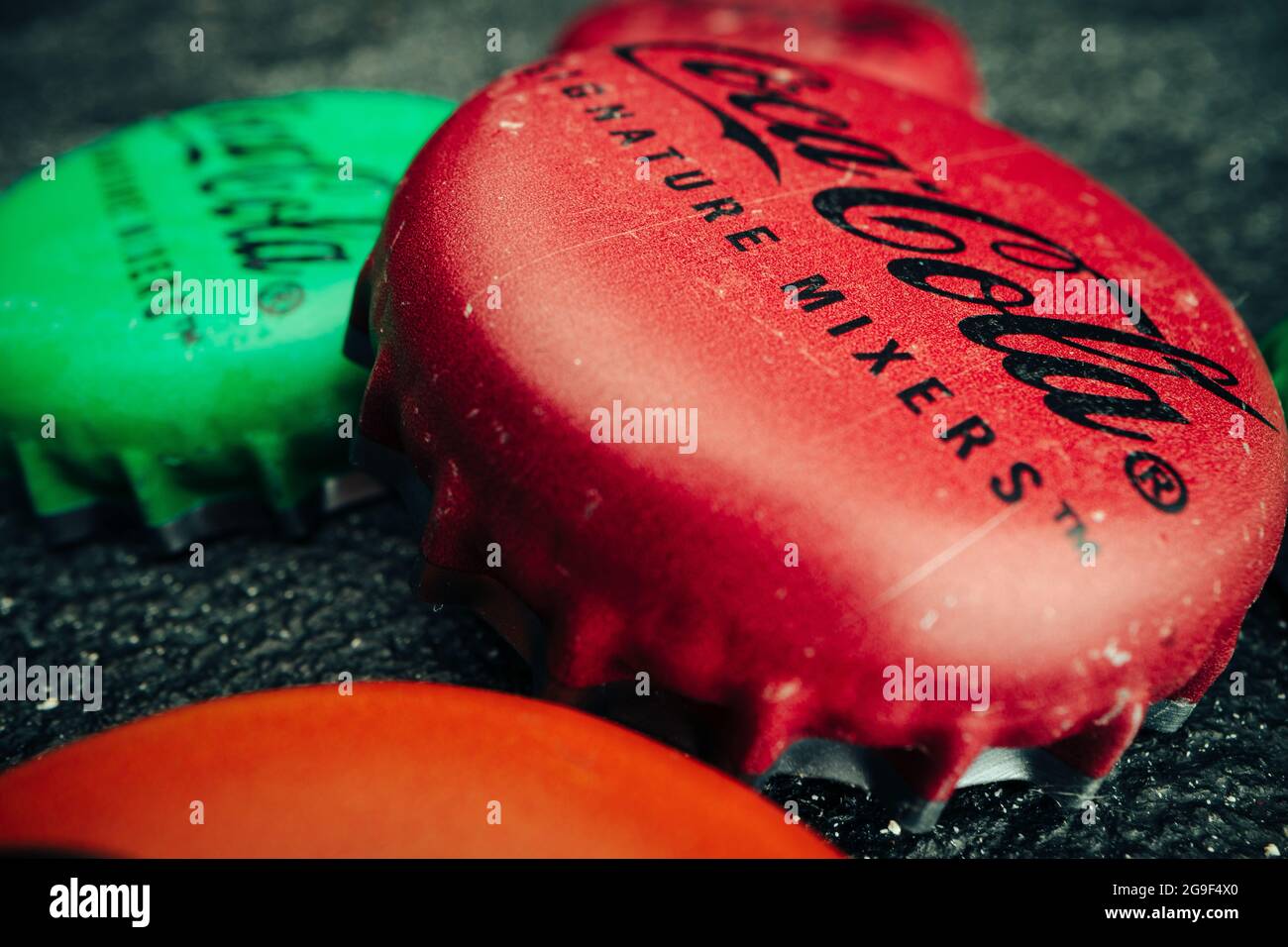 KRASNODAR, RUSSIA - NOVEMBER 9, 2020: Macro photo of Coca Cola lids on ...