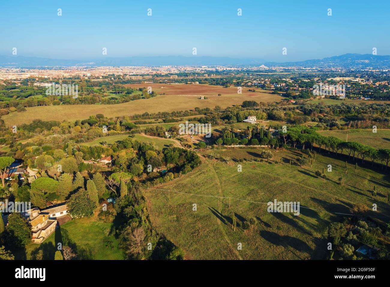 Aerial view of ancient Via Appia Antica with green trees, meadows ...